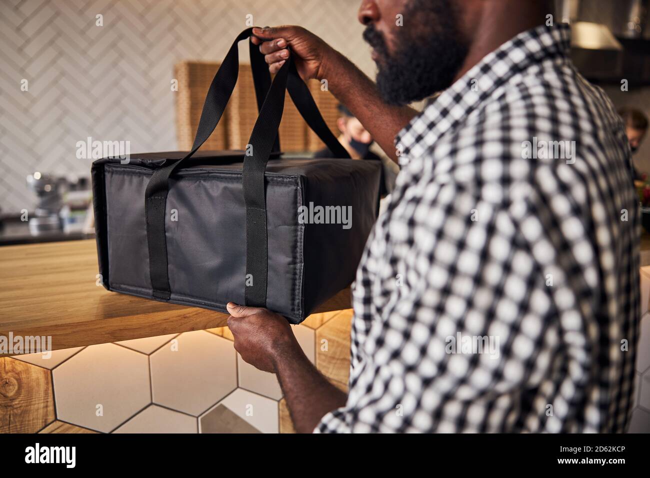 Man grabbing bag hi-res stock photography and images - Alamy