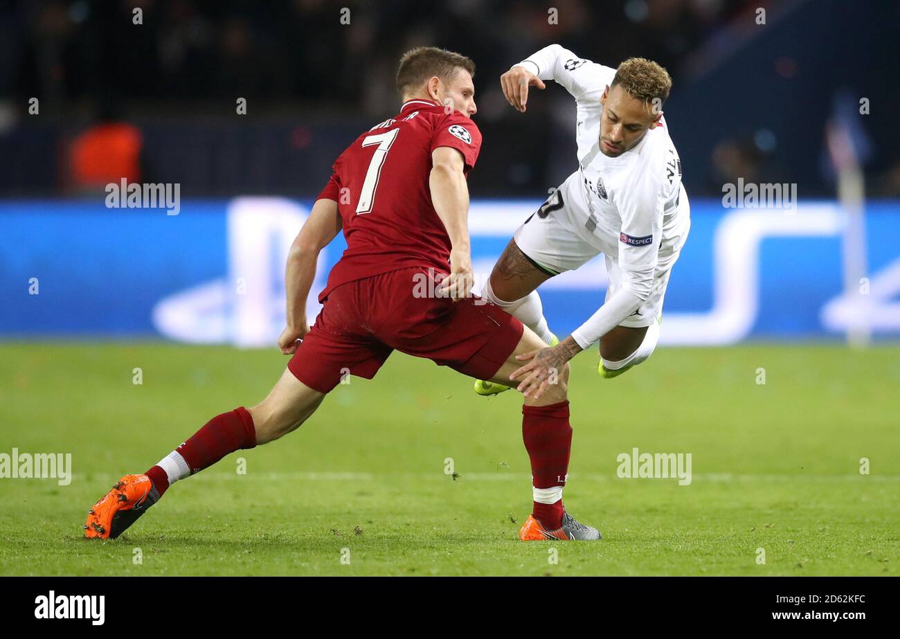Liverpool's James Milner (left) and Paris Saint-Germain's Neymar clash ...