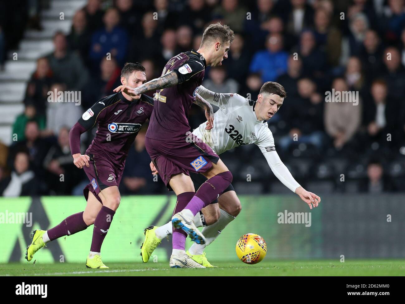 Derby County's Tom Lawrence and Swansea City's Joe Rodon battle for the ...