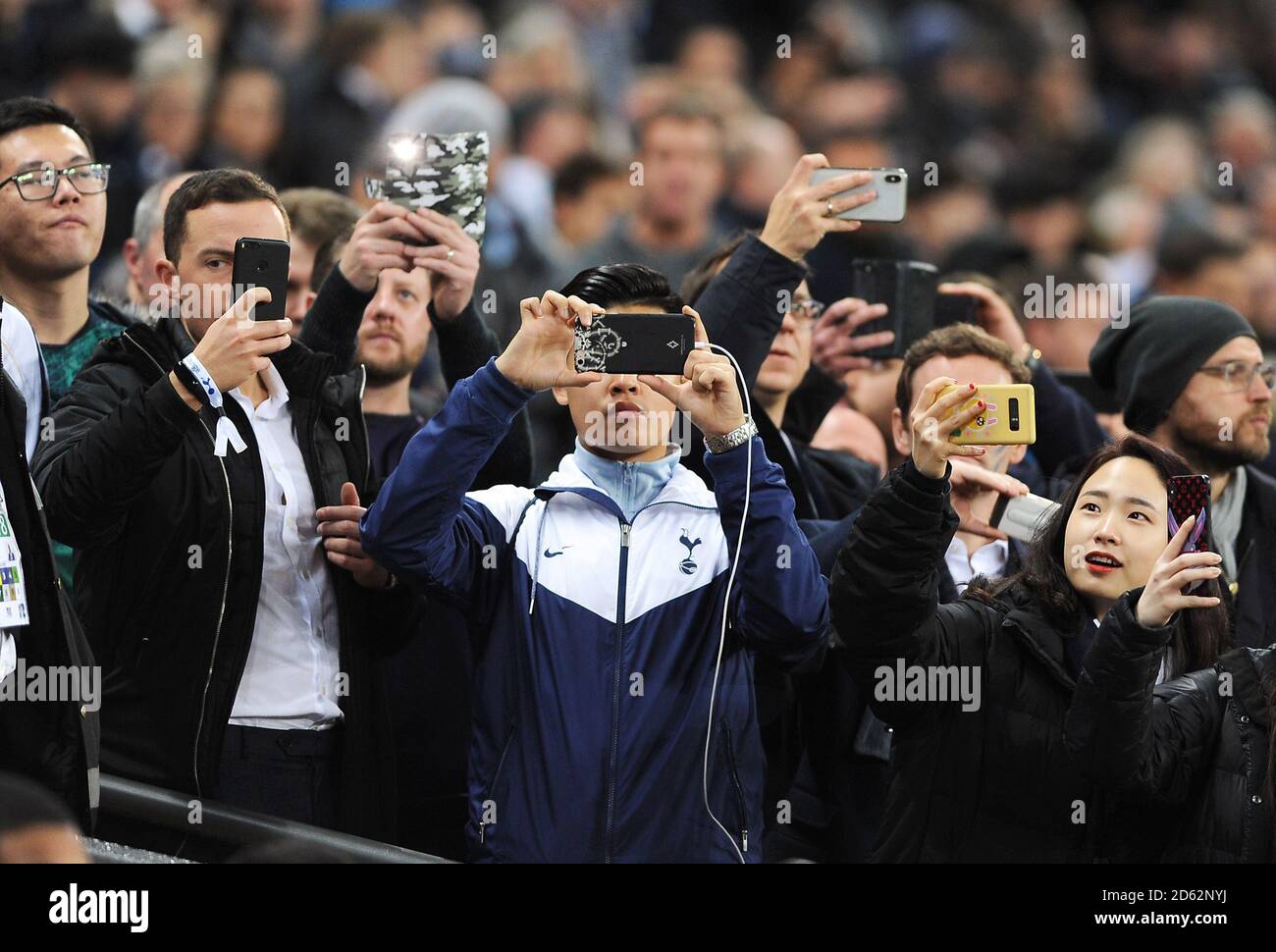 Tottenham Hotspur fans talking photos during the game Stock Photo - Alamy