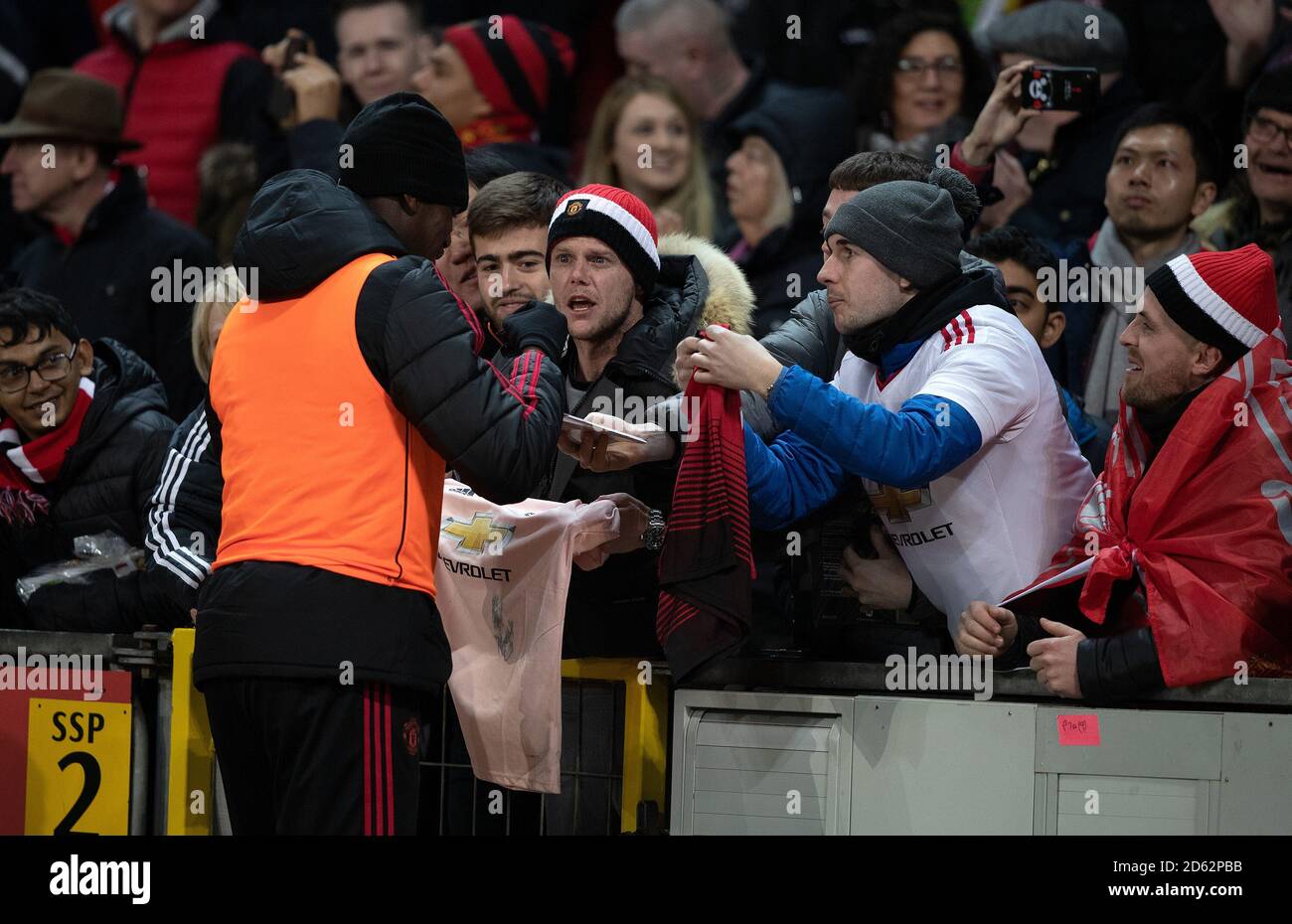 Manchester United's Paul Pogba signs autographs at the end of the match ...