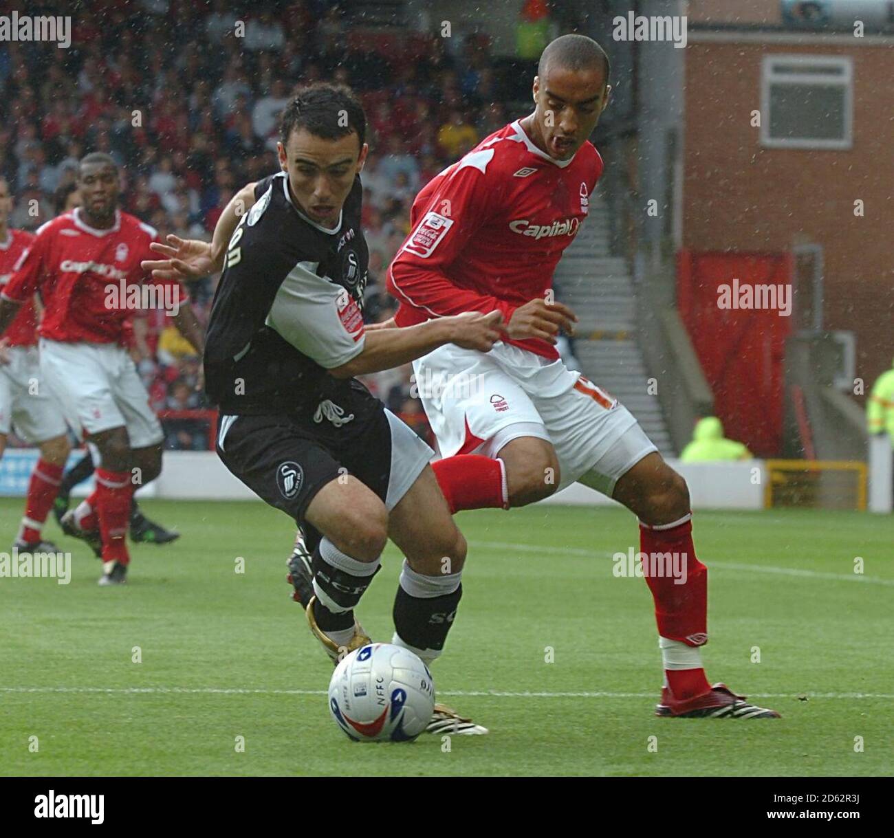 Nottingham Forest's James Perch and Swansea City's Leon Brittonbattle ...