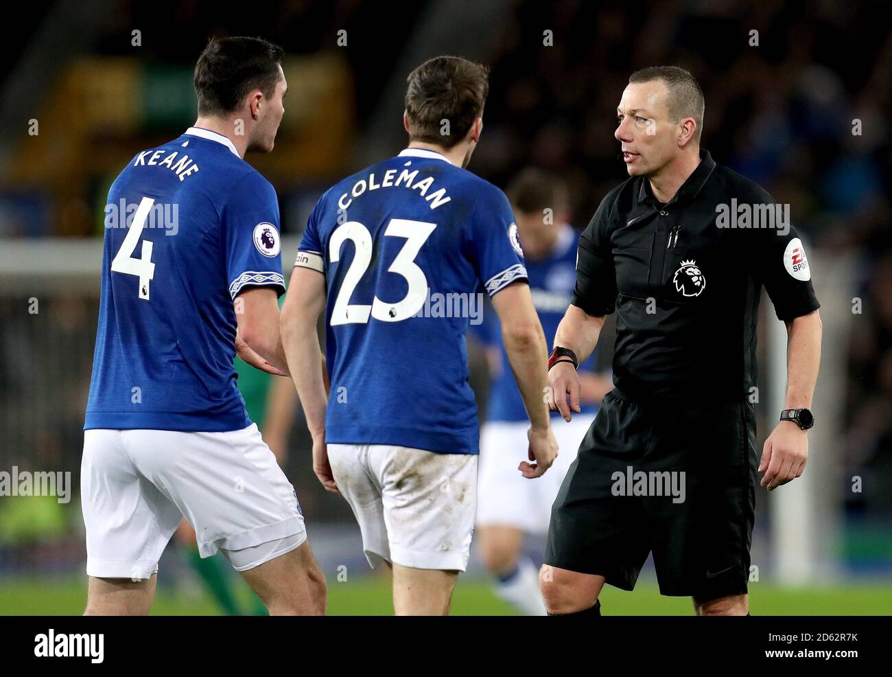 Match referee Kevin Friend speaks with Michael Keane (left) and Seamus ...