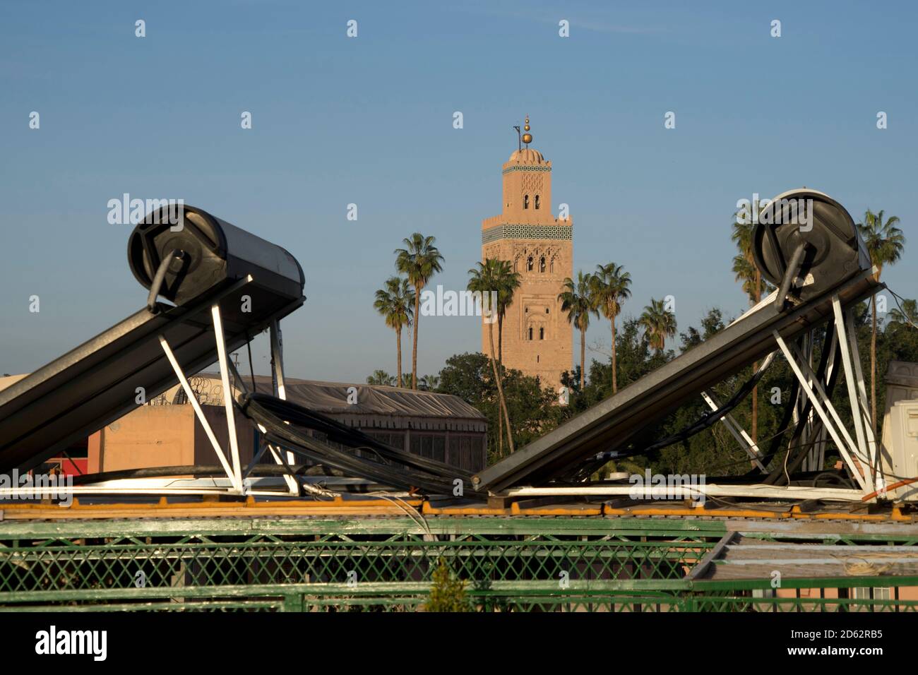 Solar panels on roofs of houses with the Koutoubia mosque in the ...