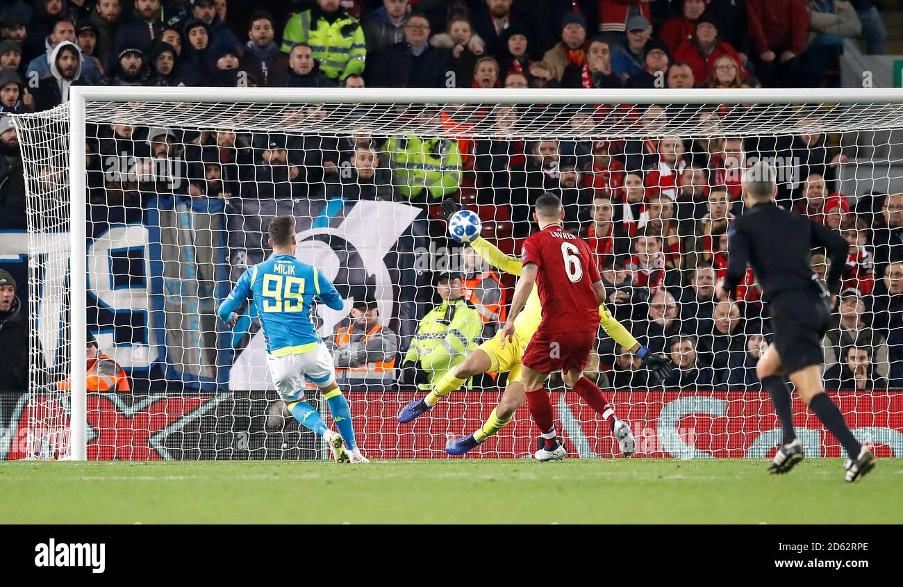 Liverpool goalkeeper Alisson Becker (centre) makes a save from Napoli's ...