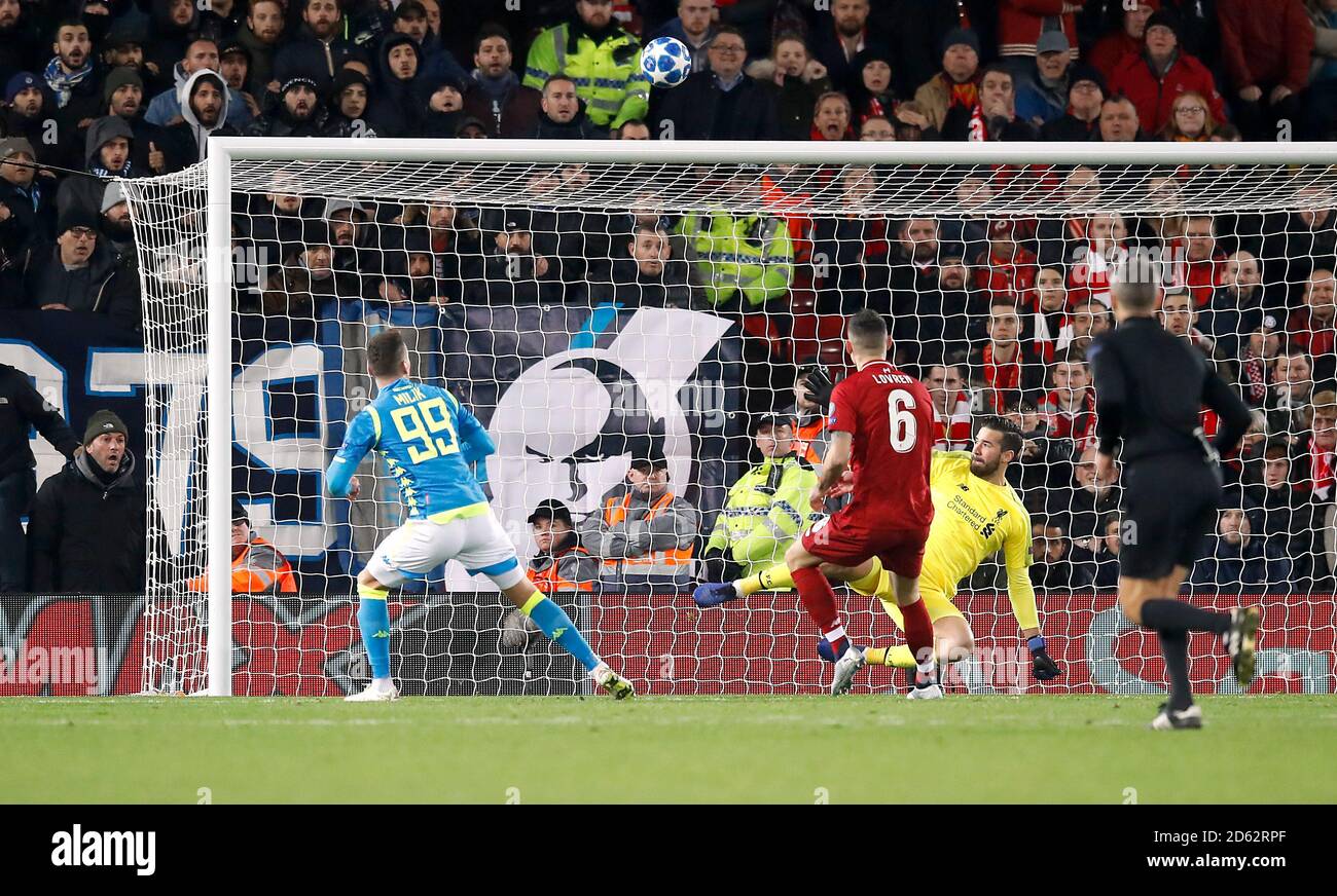 Liverpool goalkeeper Alisson Becker (centre) makes a save from Napoli's ...