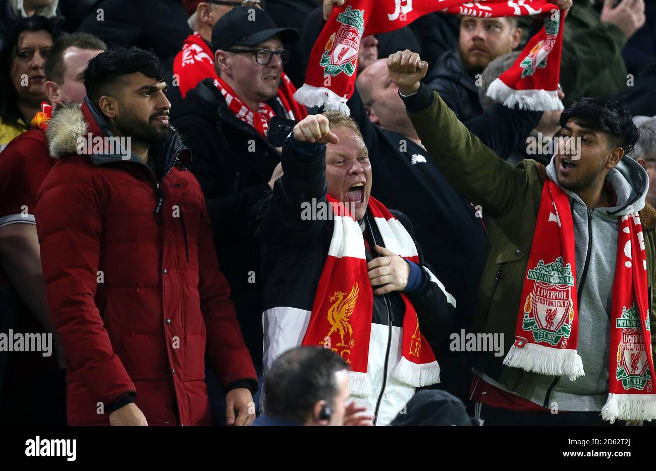 Liverpool fans react in the stands Stock Photo - Alamy