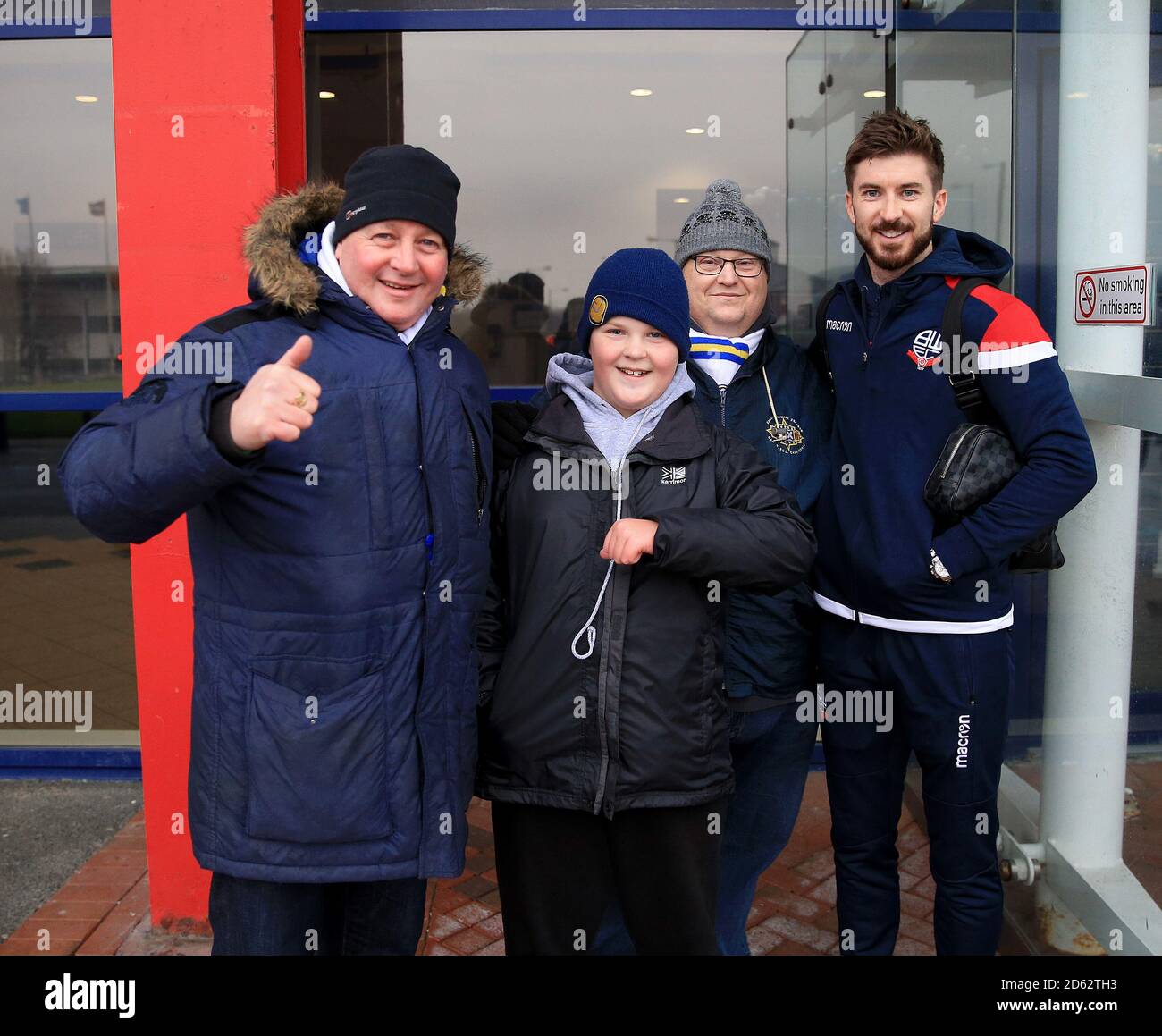 Bolton Wanderers' Luke Murphy (right) poses for a photo with some fans ...