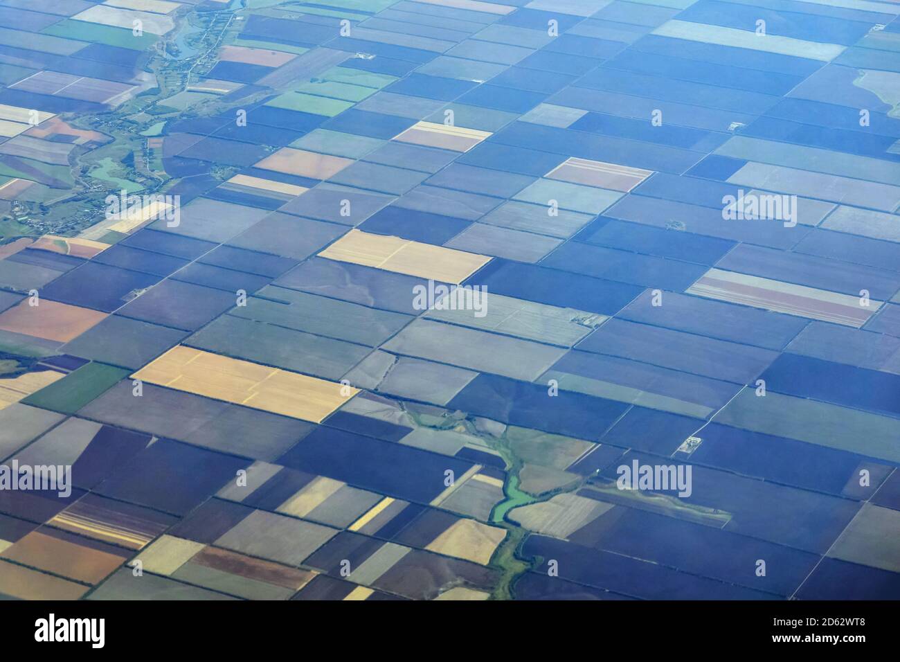 airplane view of agricultural region with multicolored rectangular ...