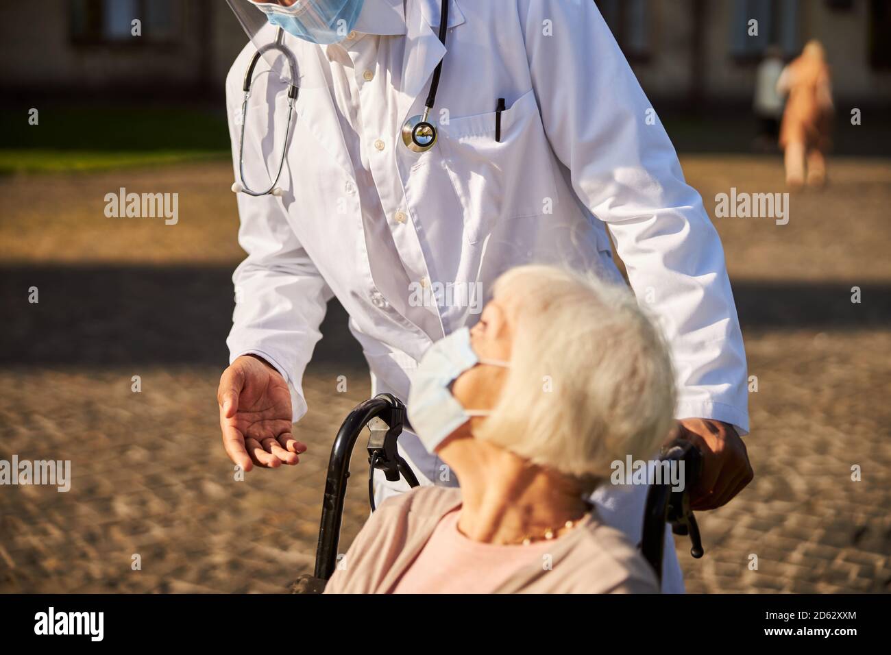 Medical professional asking a question to an aging woman Stock Photo ...