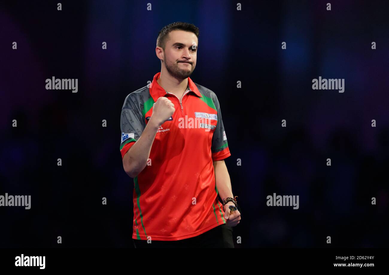 Jamie Lewis celebrates during his match against Daryl Gurney during day ...