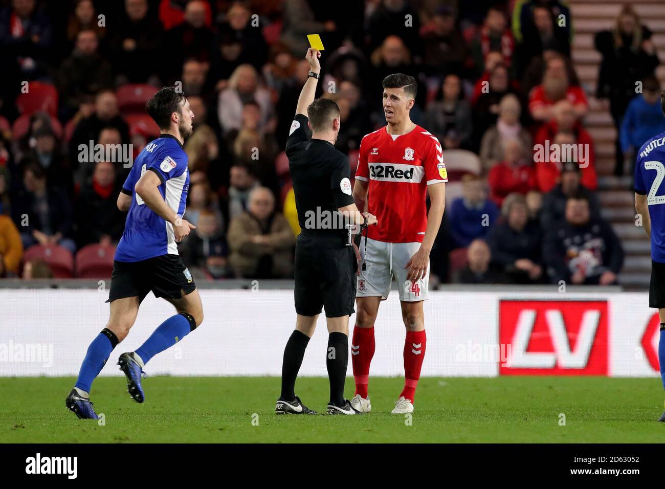 Referee Peter Bankes books Middlesbrough's Daniel Ayala Stock Photo - Alamy