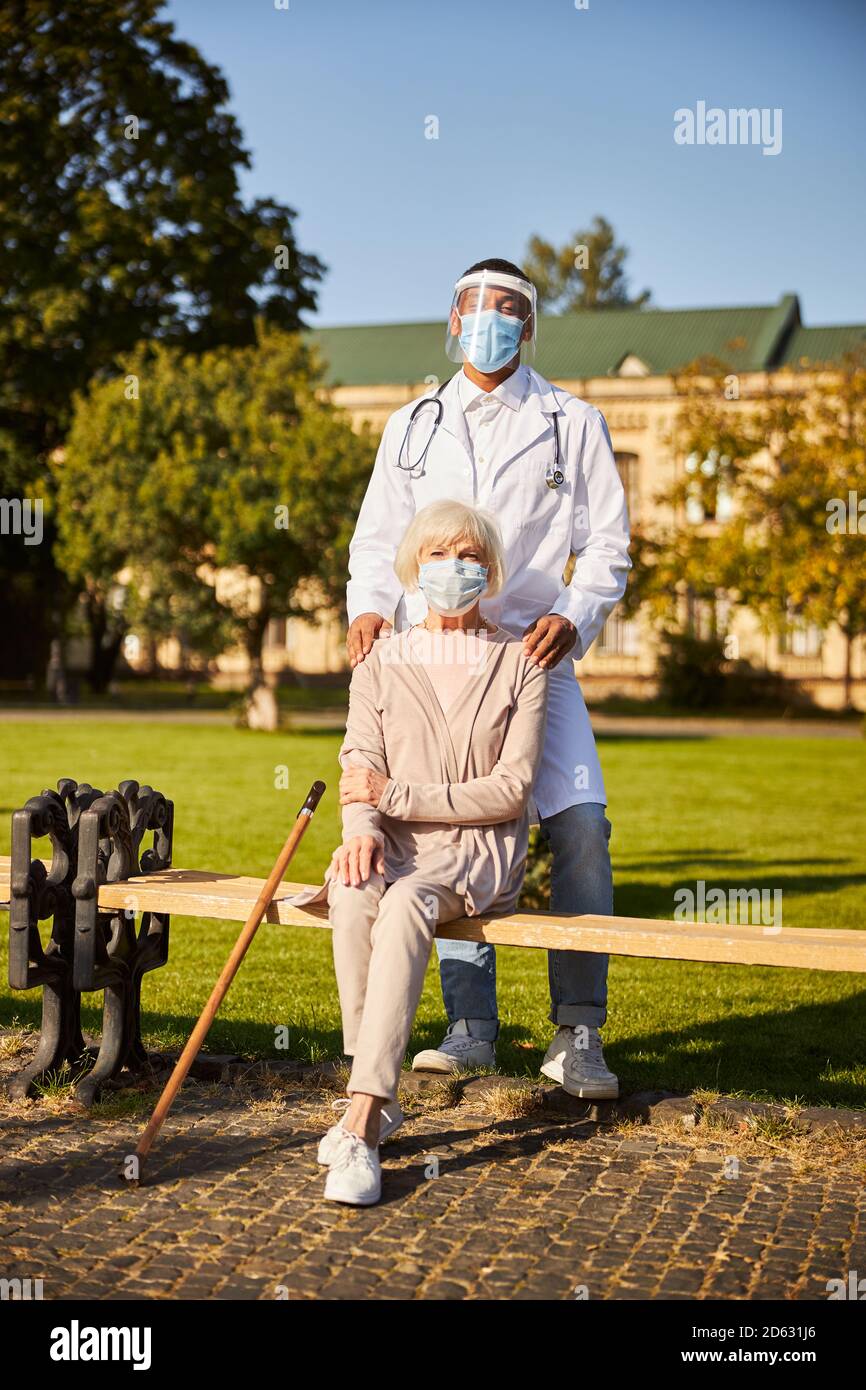 Medical doctor sitting on bench hi-res stock photography and images - Alamy