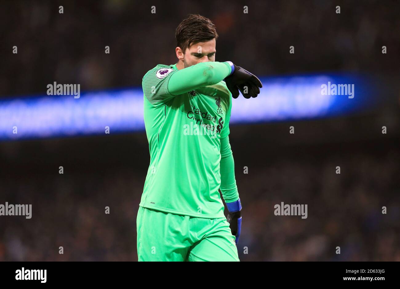 Liverpool goalkeeper Alisson Becker shows his dejection after his side ...