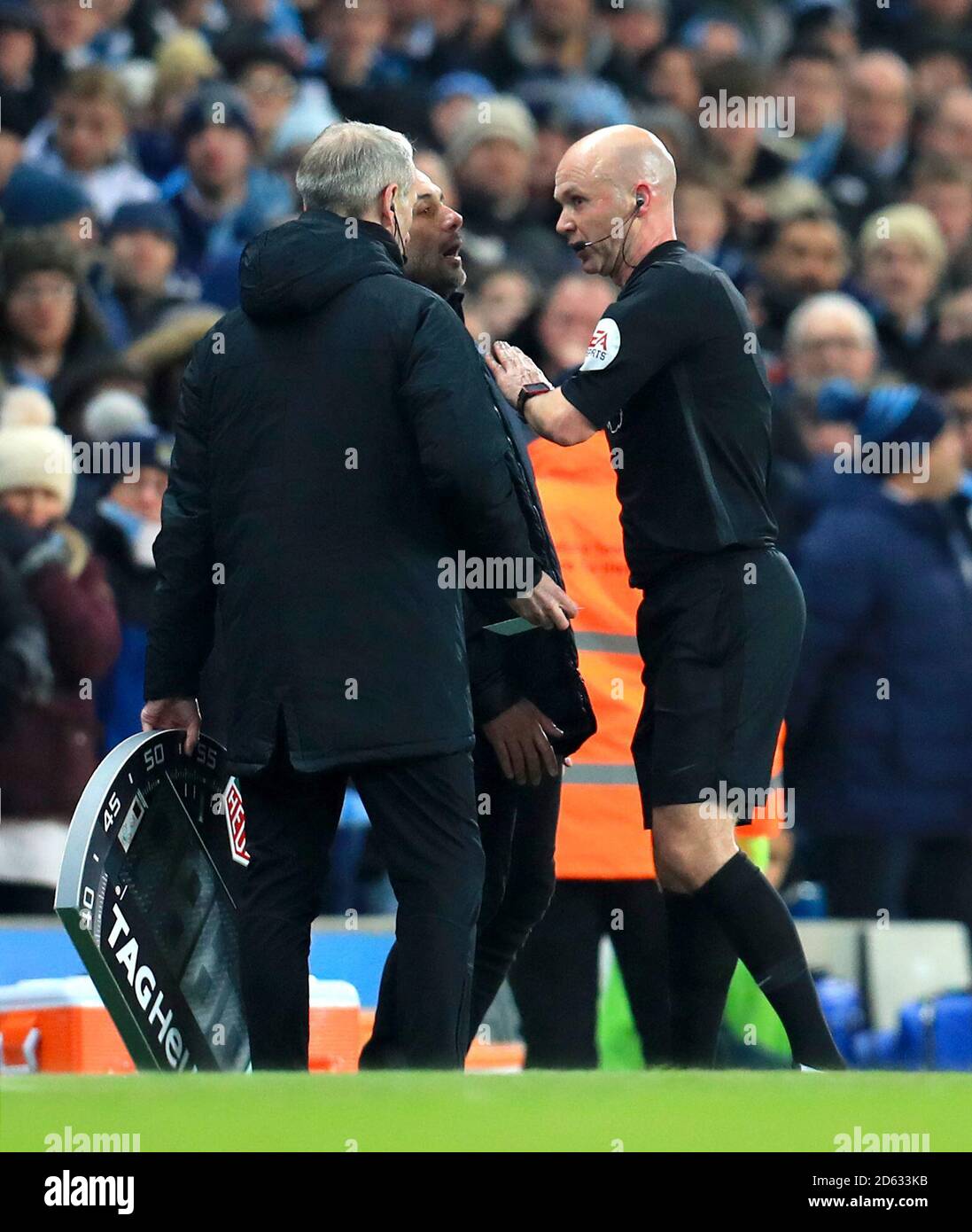 Referee Anthony Taylor has words with Manchester City manager Pep ...