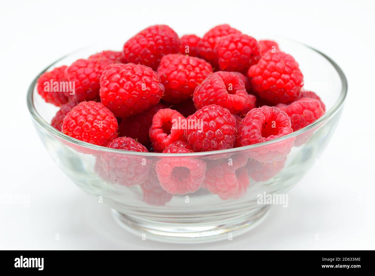 Glass bowl of Ripe Raspberries Stock Photo - Alamy