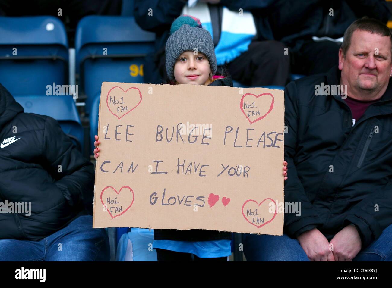 A young Coventry City fan holds up a banner for Coventry City ...