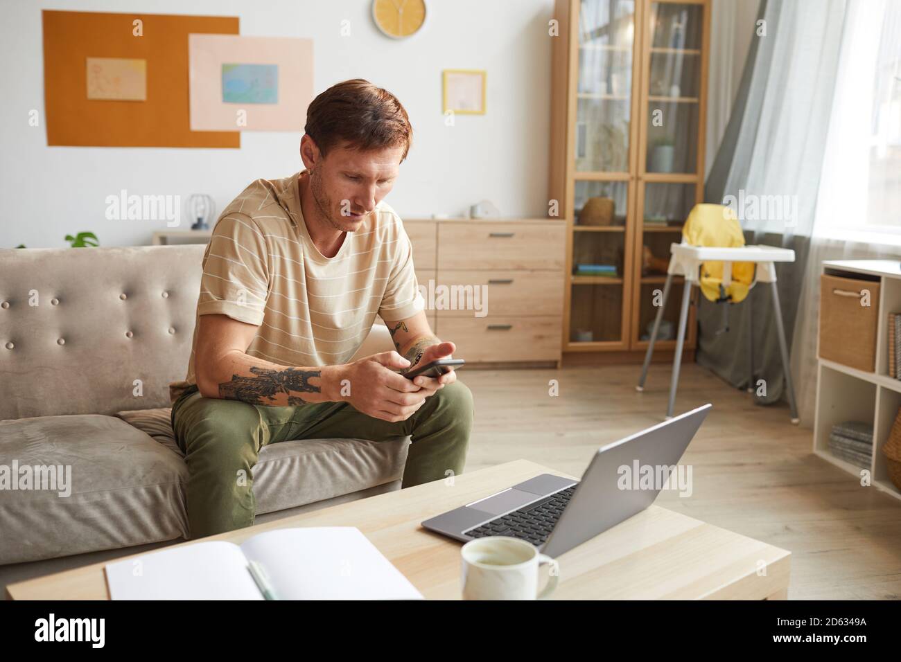 Mature adult home phone laptop hi-res stock photography and images - Alamy