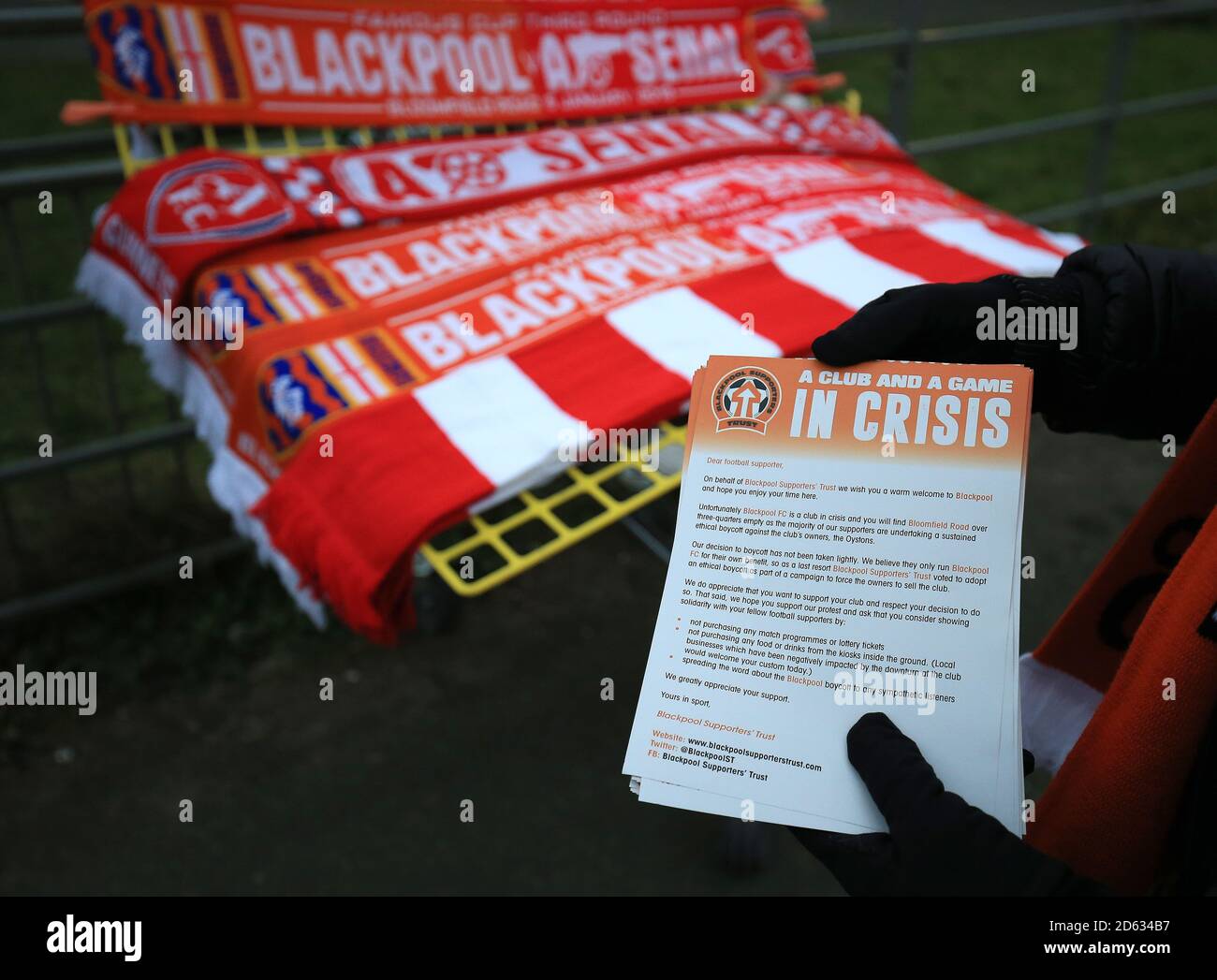 Leaflets protesting about the club owners are handed out outside the ...