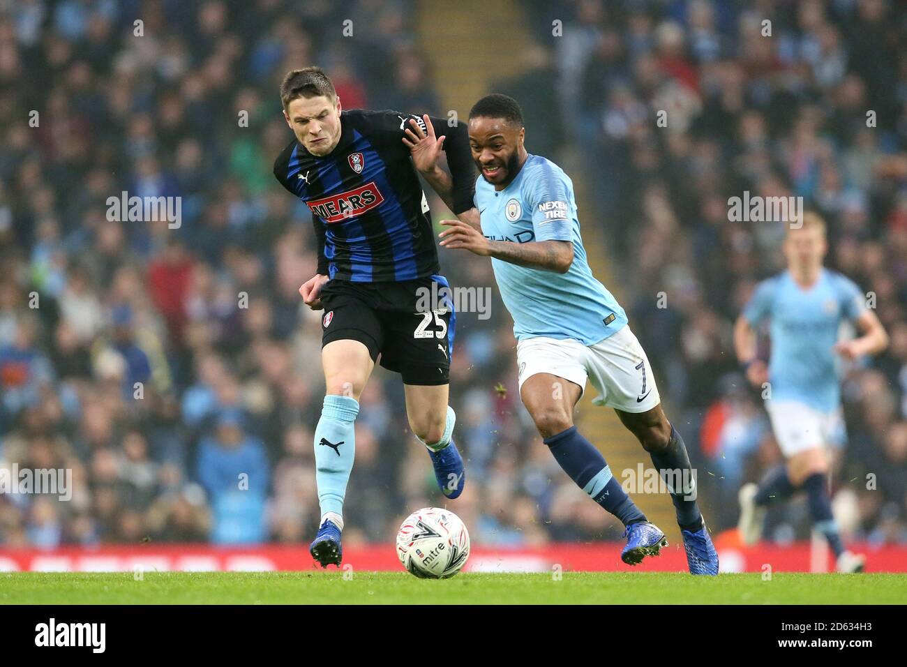 Rotherham United's Ben Wiles (left) and Manchester City's Raheem ...