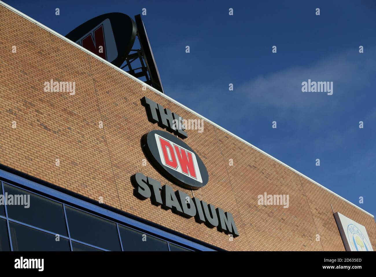 A general view of signage at The DW Stadium Stock Photo - Alamy