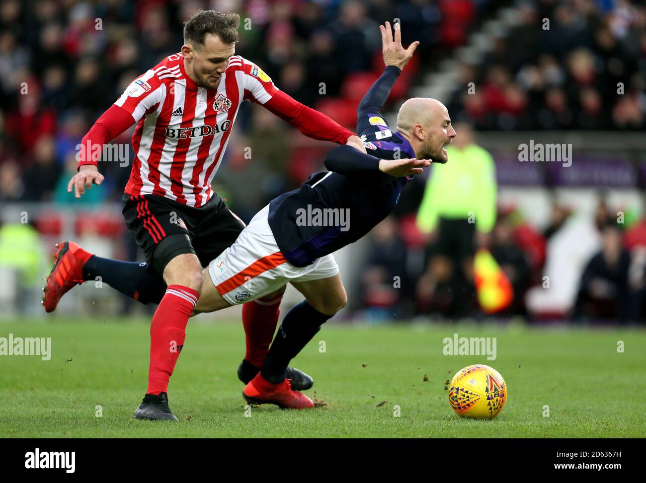 Luton Towns Alan McCormack is foulded by Sunderland's Charlie Wyke ...