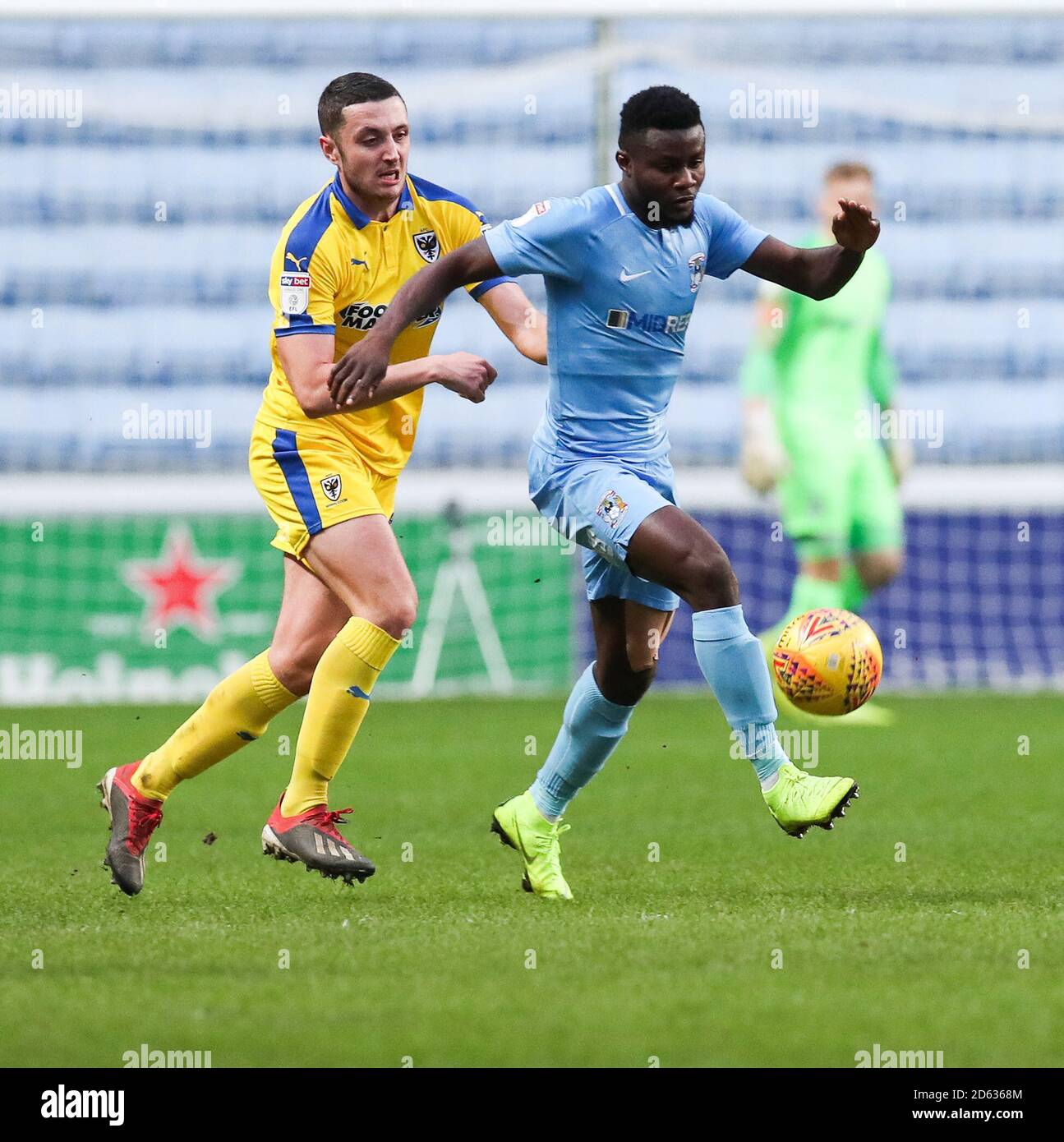 Coventry City's Bright Anobakhare and AFC Wimbledon's Anthony Hartigan ...