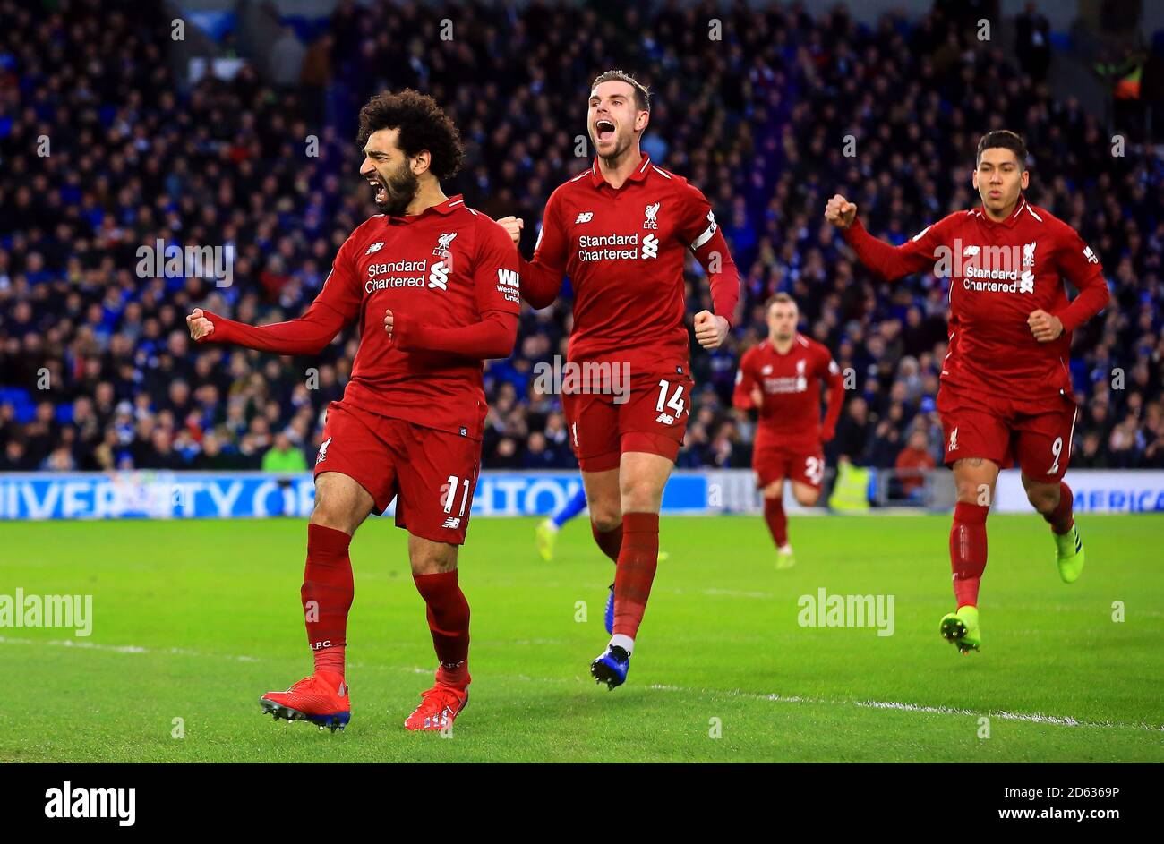 Liverpool's Mohamed Salah (left) celebrates scoring his side's first ...