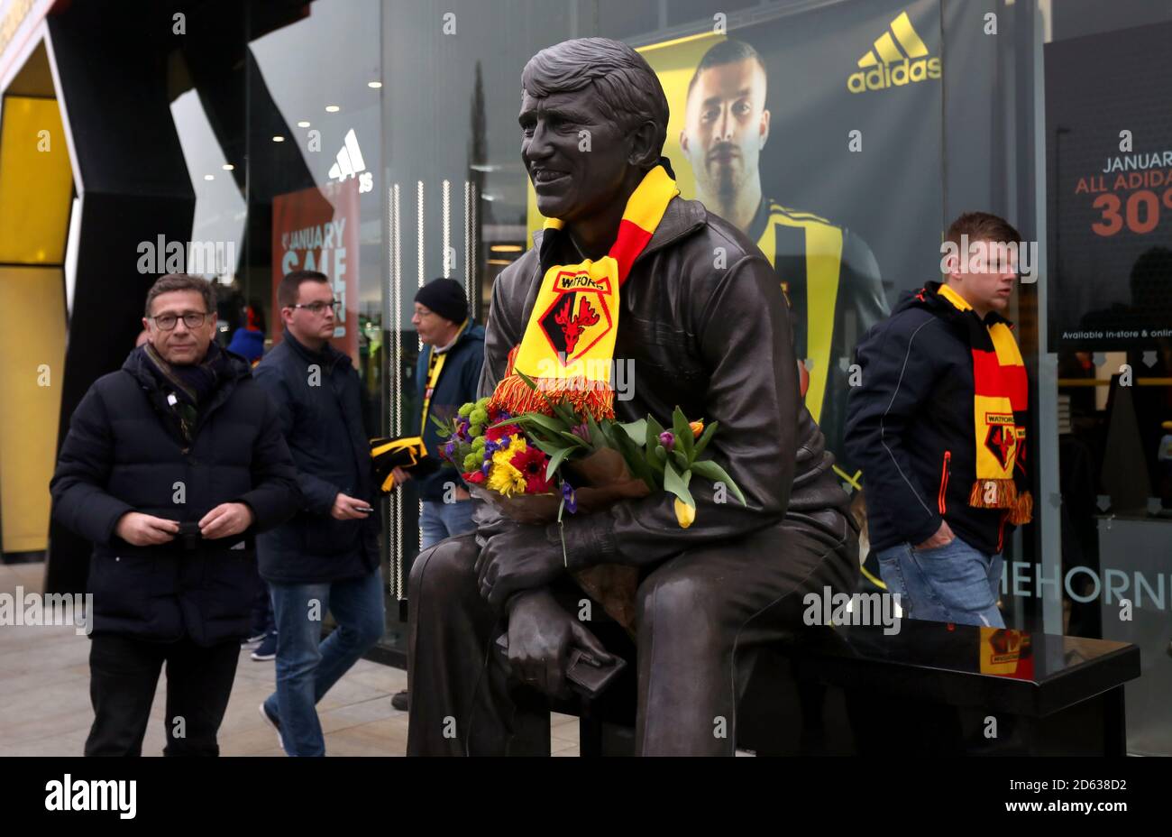 A fan lays flowers at the Graham Taylor statue outside of Vicarage Road ...