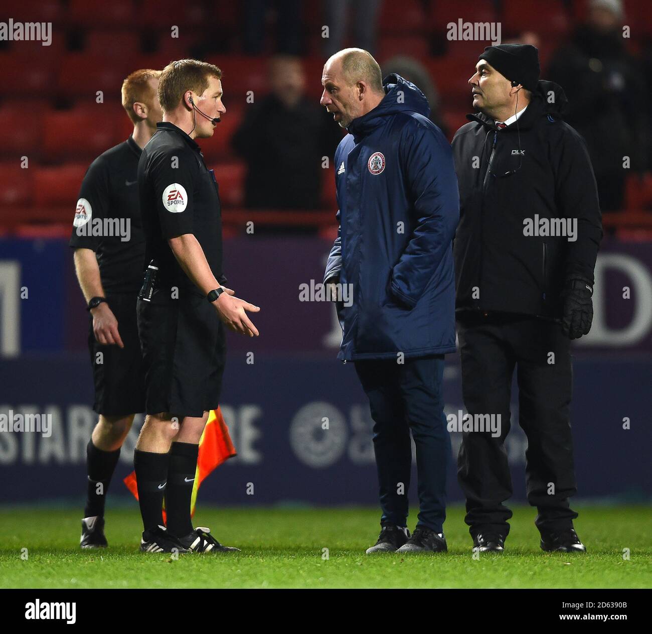Accrington Stanley manager John Coleman (centre) confronts referee John ...