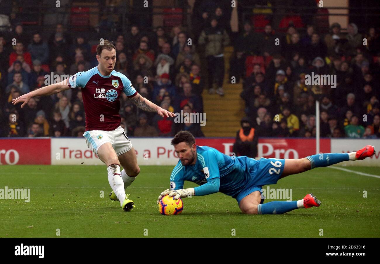 Watford goalkeeper Ben Foster saves at the feet of Burnley's Ashley ...