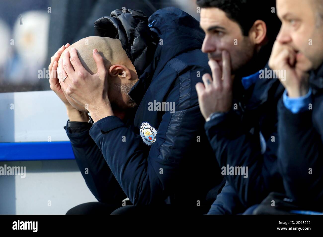 Manchester City manager Pep Guardiola holds his head in his hands Stock ...