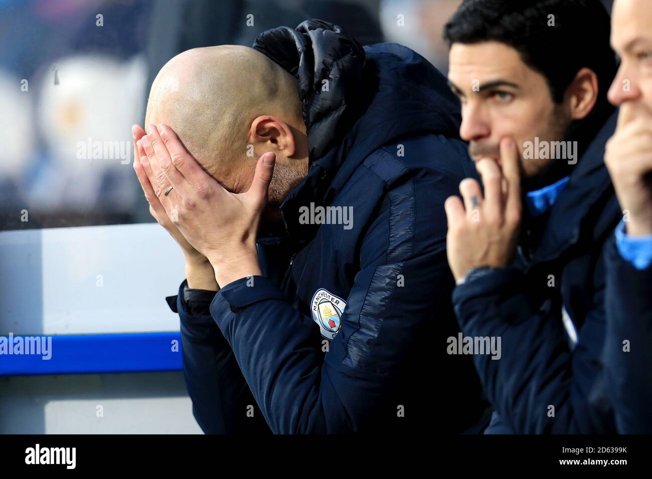 Manchester City manager Pep Guardiola holds his head in his hands Stock ...