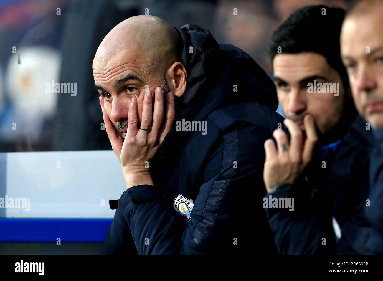 Manchester City manager Pep Guardiola holds his head in his hands Stock ...