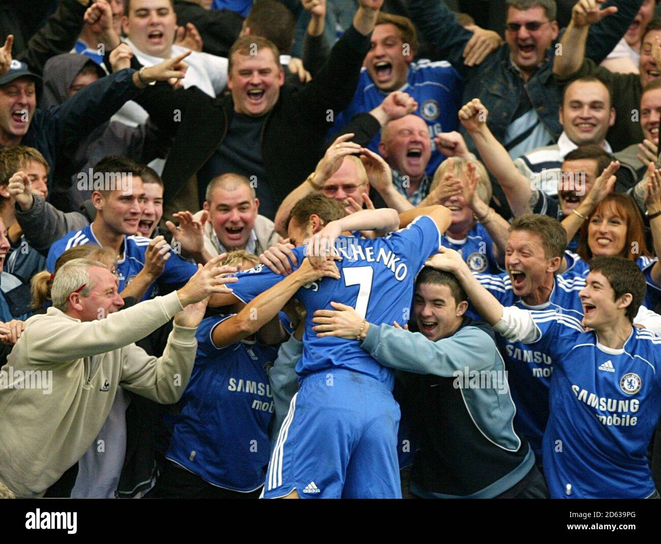 Half length mid top hugging goal celebration hi-res stock photography ...