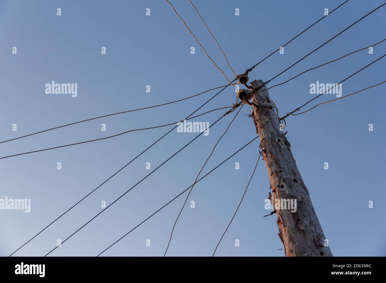 Closer look of the electric post with the big wires on it. Post with ...