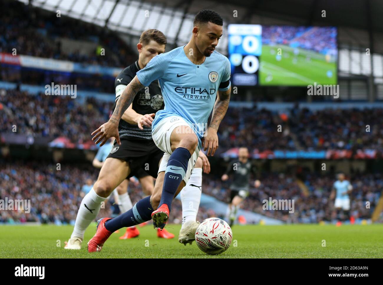 Burnley's James Tarkowski (left) and Manchester City's Gabriel Jesus ...