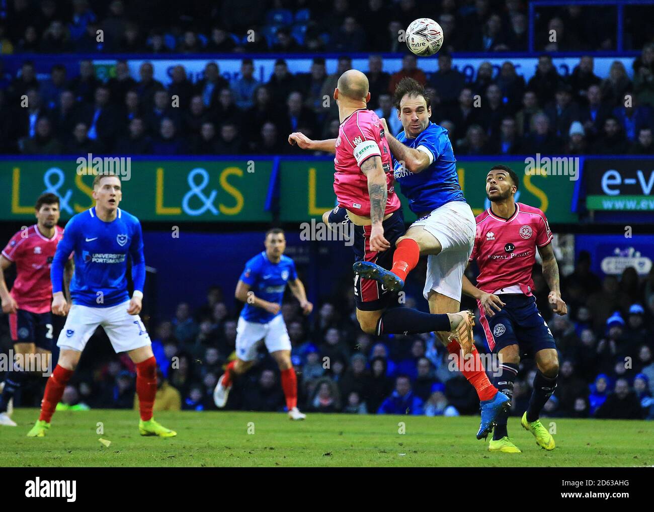 Portsmouth's Brett Pitman and Queens Park Rangers' Toni Leistner clash ...