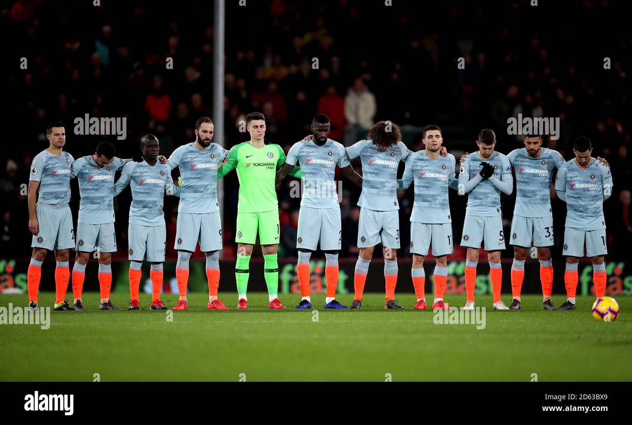 Chelsea players stand during a minute's silence for missing footballer ...