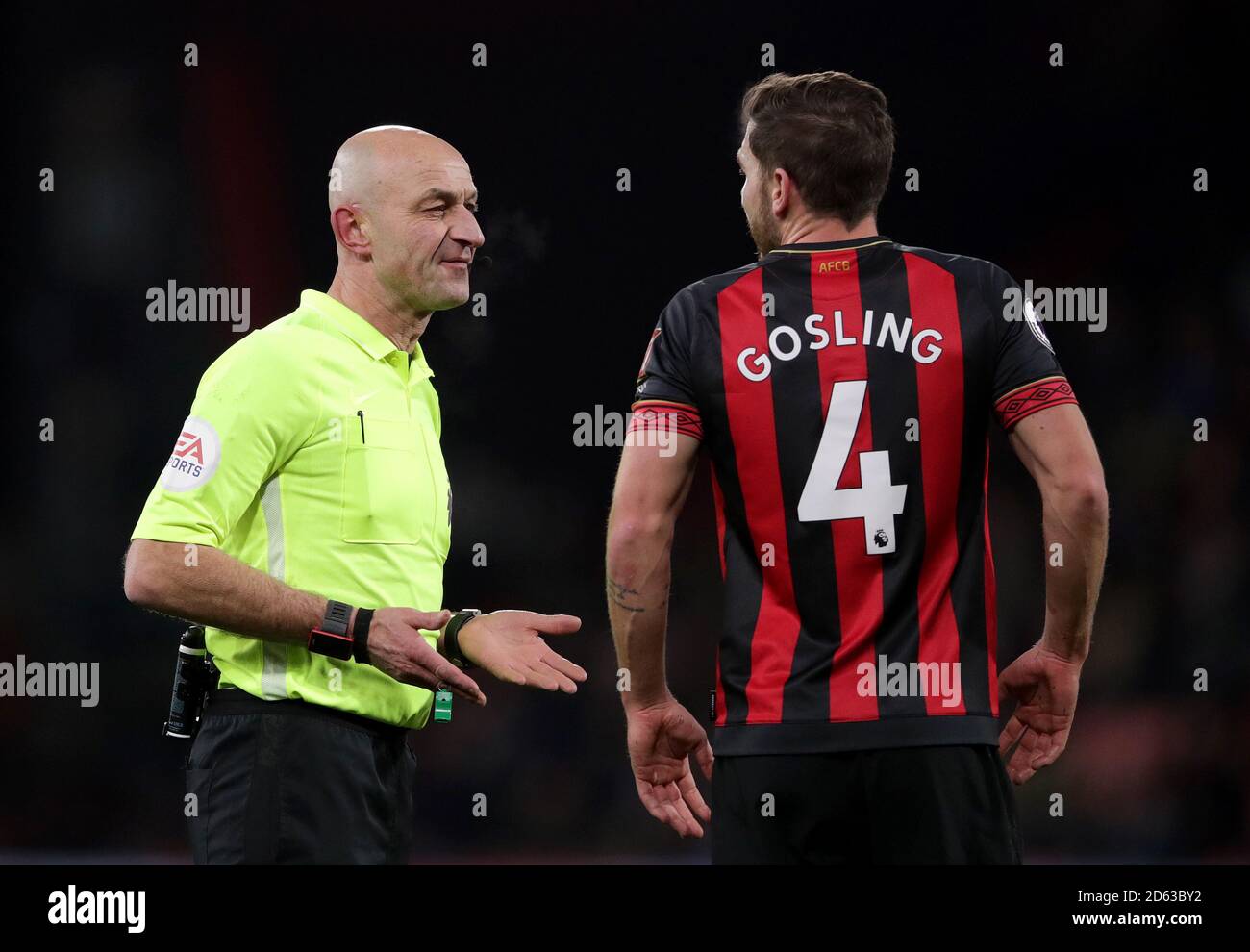 Match referee Roger East (left) speaks with AFC Bournemouth's Dan ...