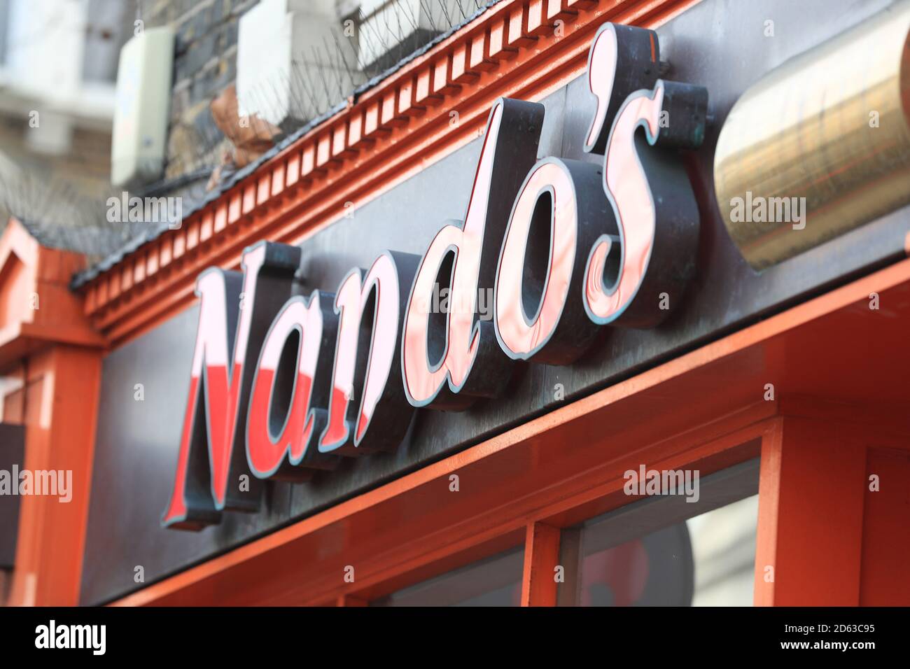 A view of a sign for a Nando's fast food restaurant in London Stock ...