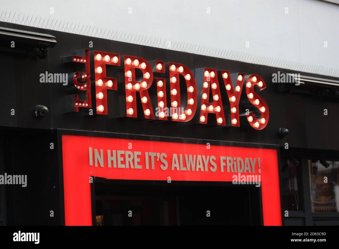 A view of a sign for a TGI Fridays restaurant in London Stock Photo - Alamy