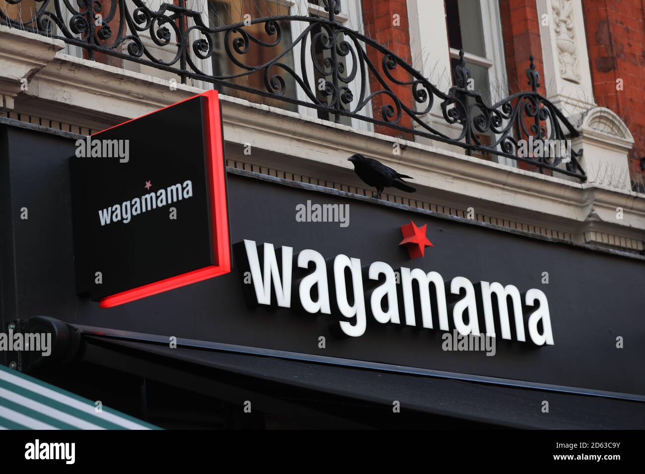 A view of a sign for a Wagamama restaurant in London Stock Photo - Alamy