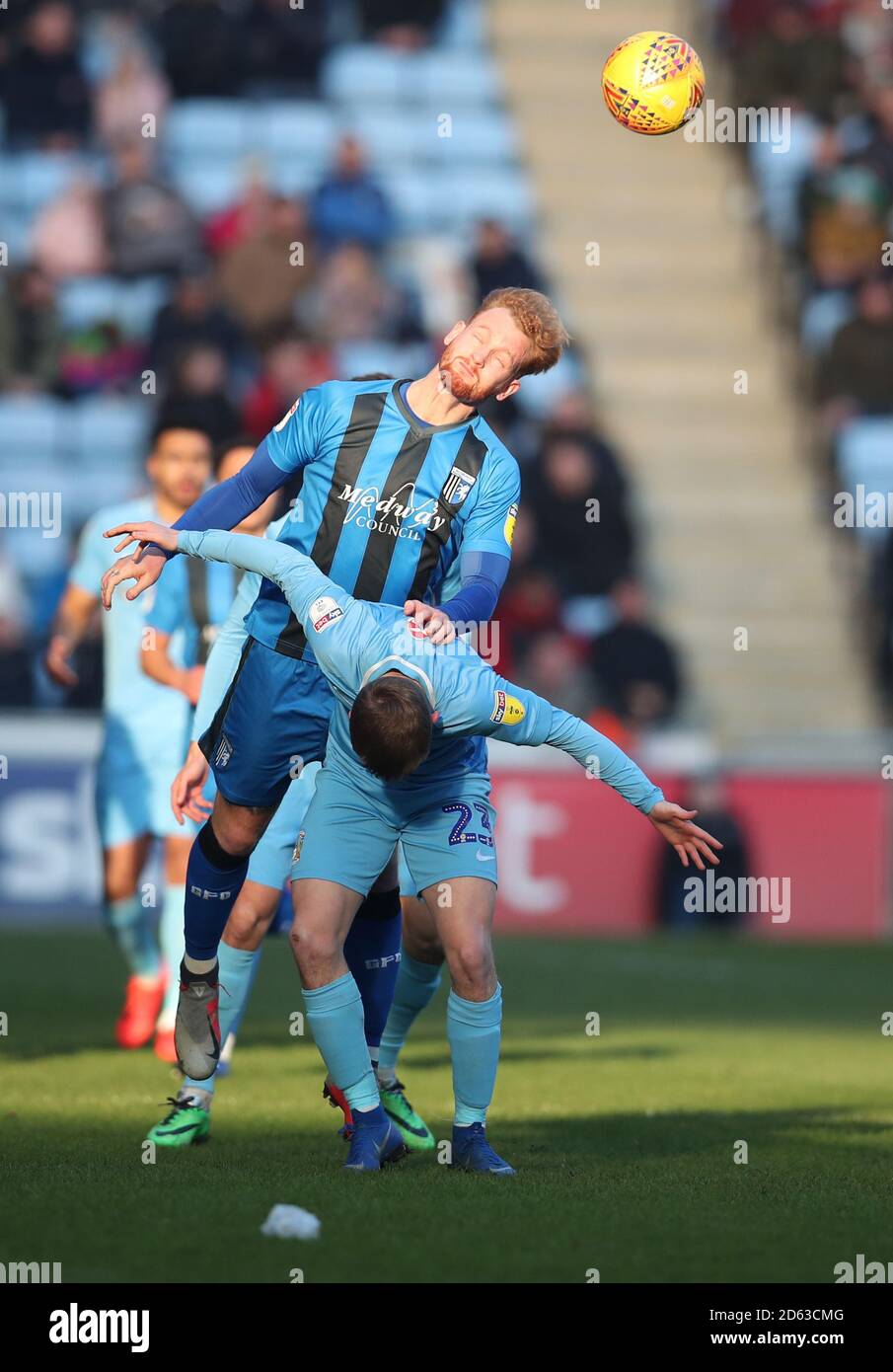Coventry City's Luke Thomas and Gillingham's Josh Rees battle for the ...