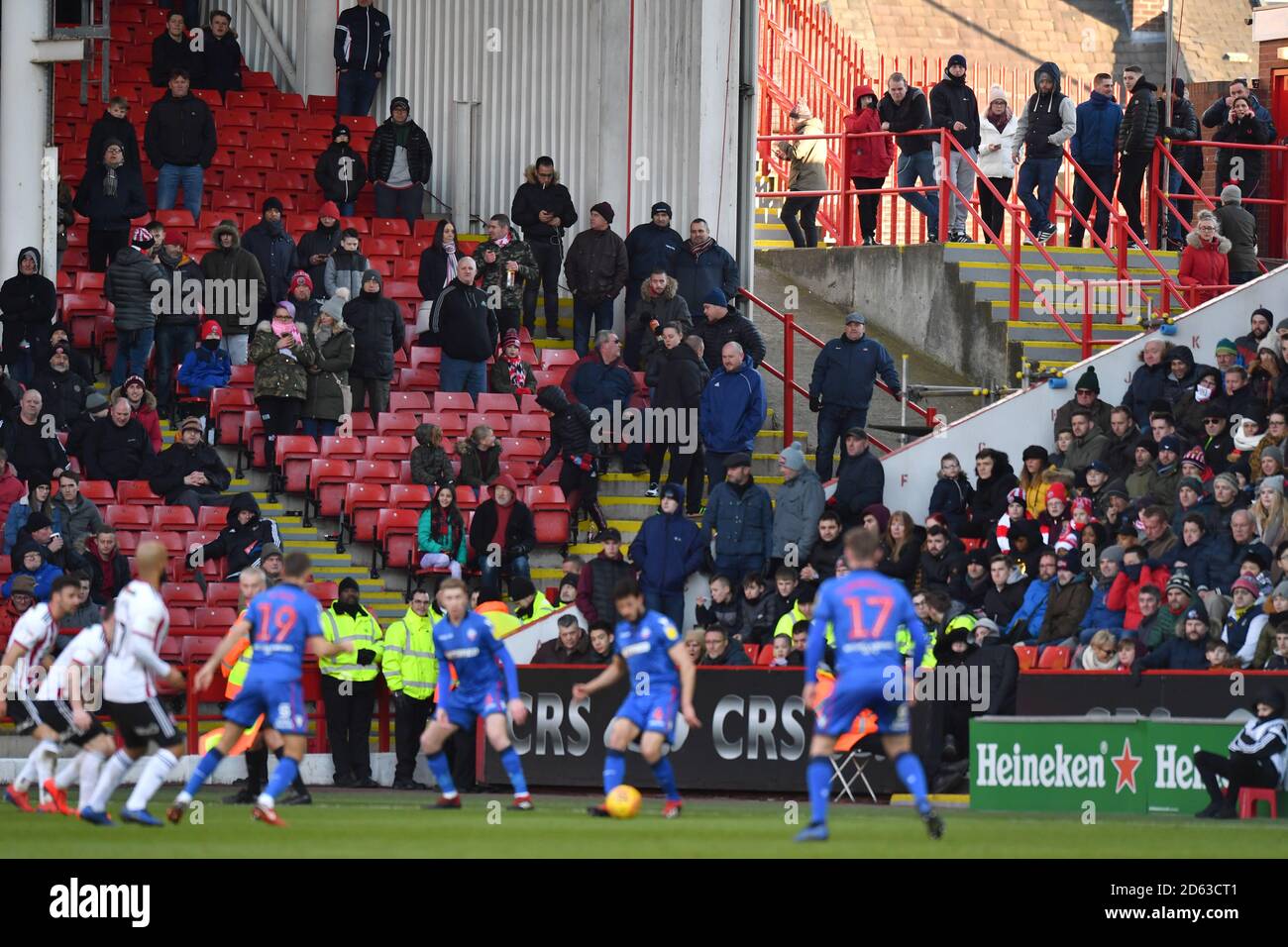 Fans watch the action form the steps of the Kop stand Stock Photo - Alamy