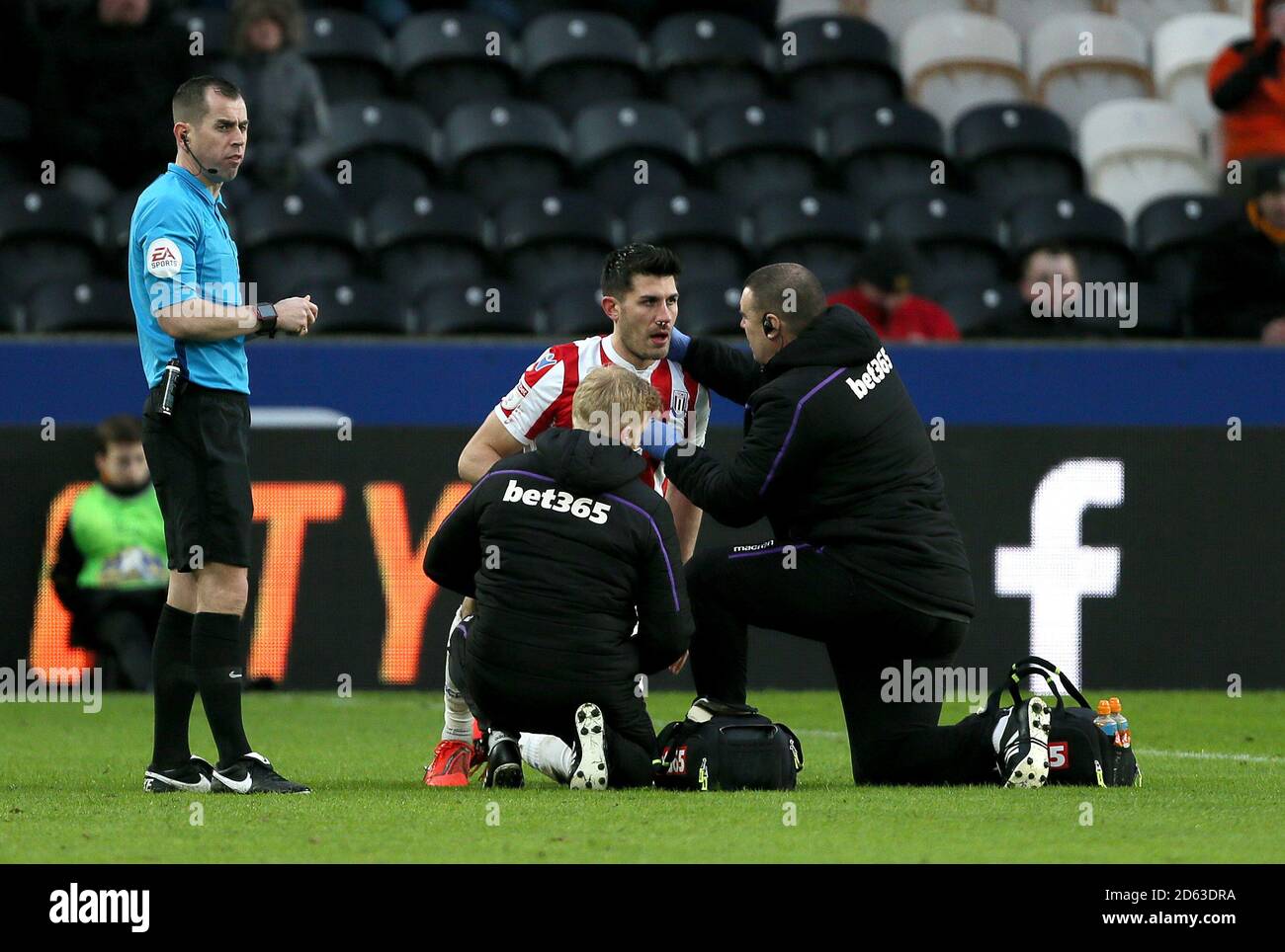 Stoke City's Danny Batth is treated for an injury by the medical staff ...