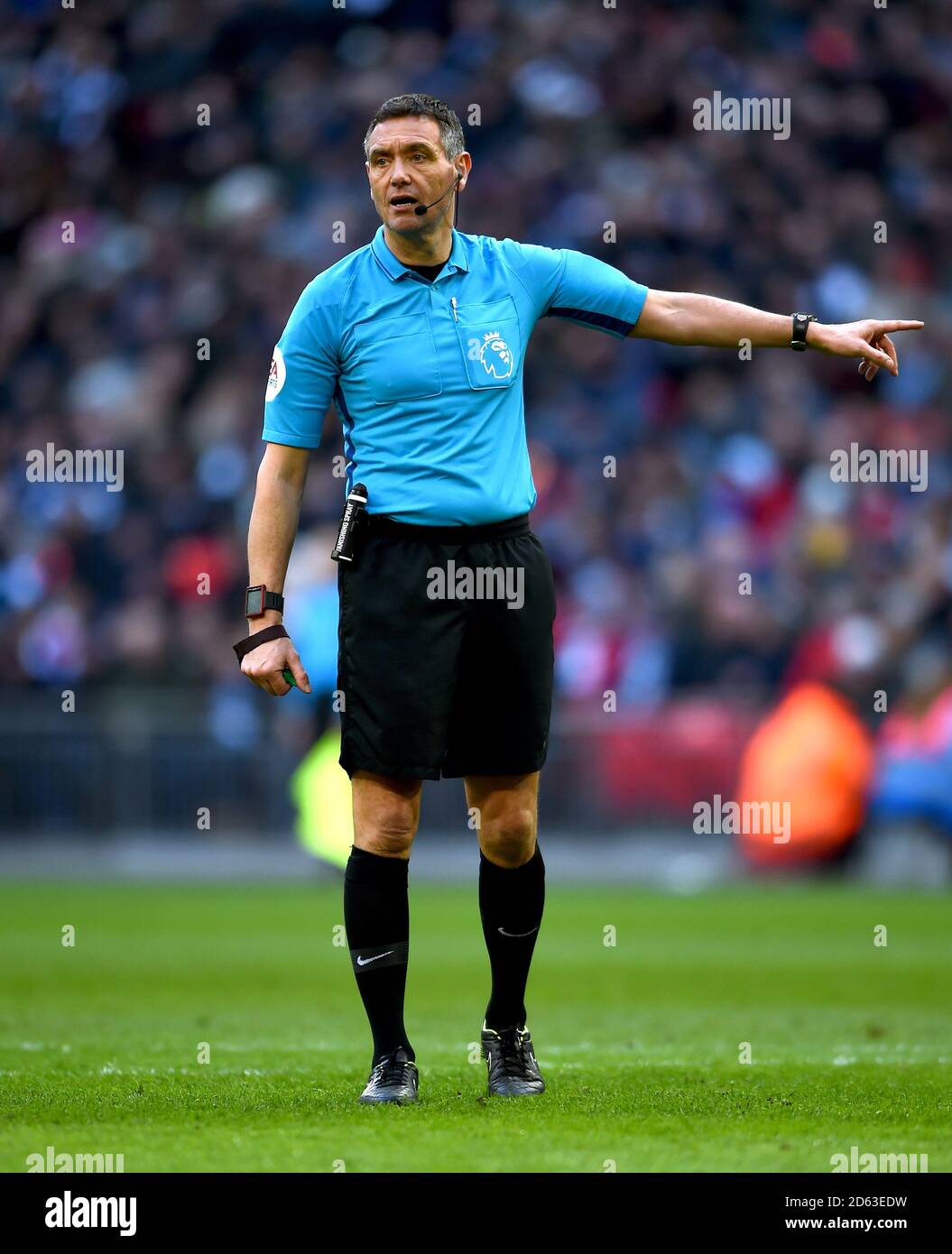Referee Andre Marriner gestures on the pitch during the match Stock ...