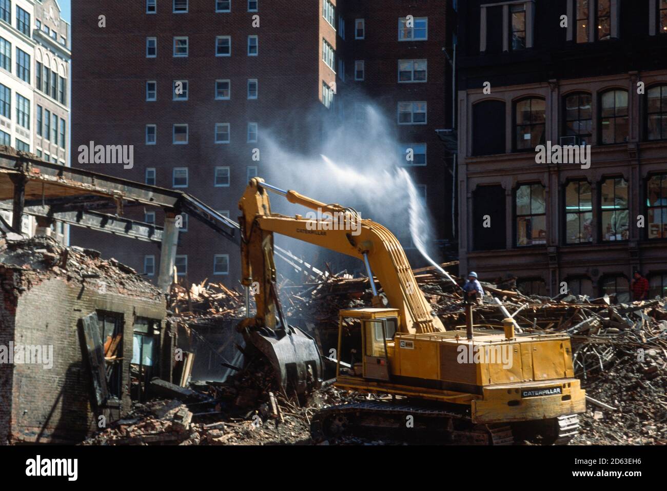 Workers and Claw Machine Tear Down a Building to Prepare for New ...