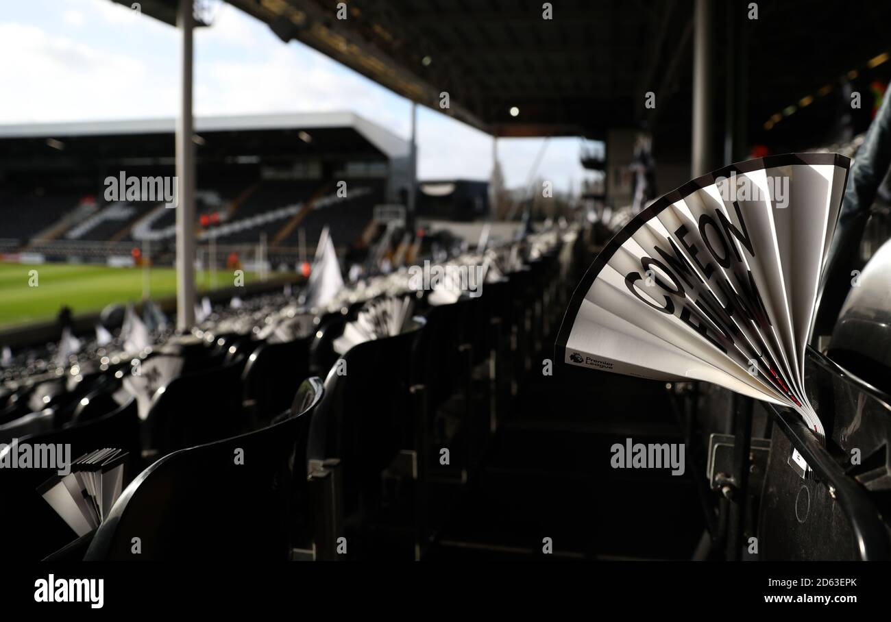 Fulham branded paper fans in the stands Stock Photo - Alamy