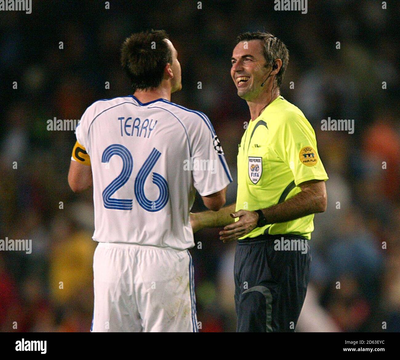 Chelsea captain John Terry shares a joke with referee Stefano Farina ...
